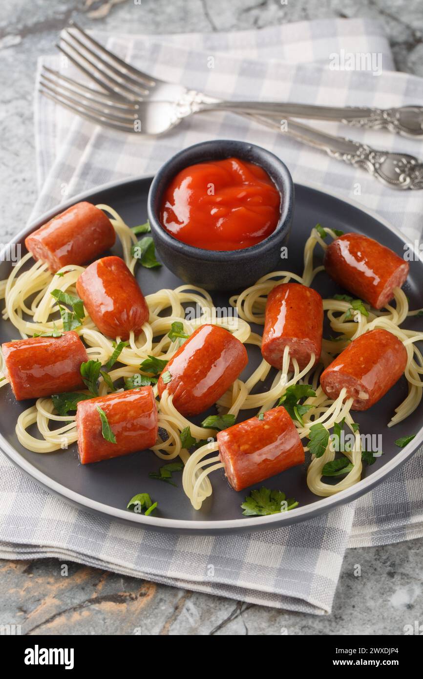 Halloween spiders dish of spaghetti with sausages and ketchup close-up ...
