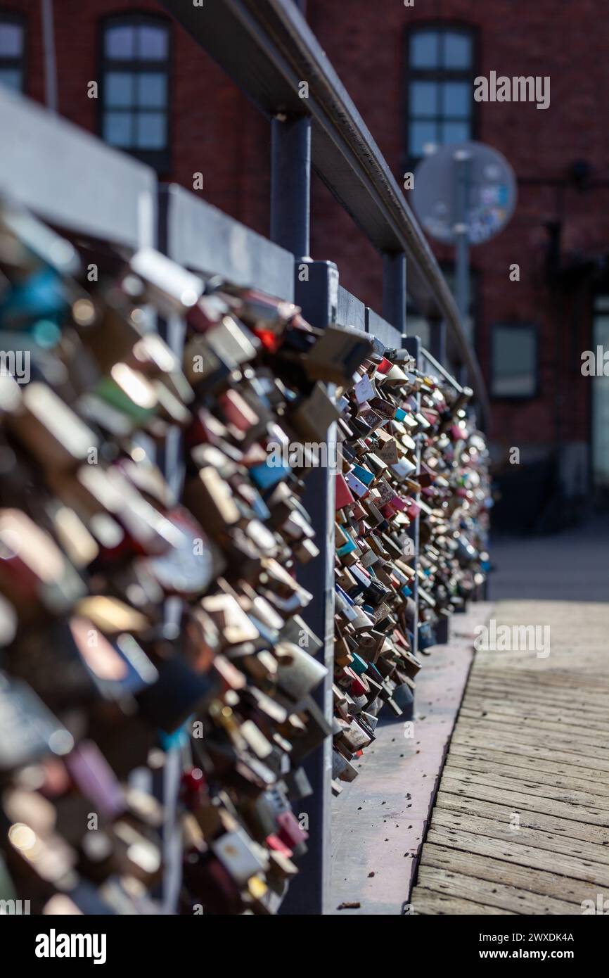 Love lock bridge at Katajanokka with many locks. Couples putting locks ...