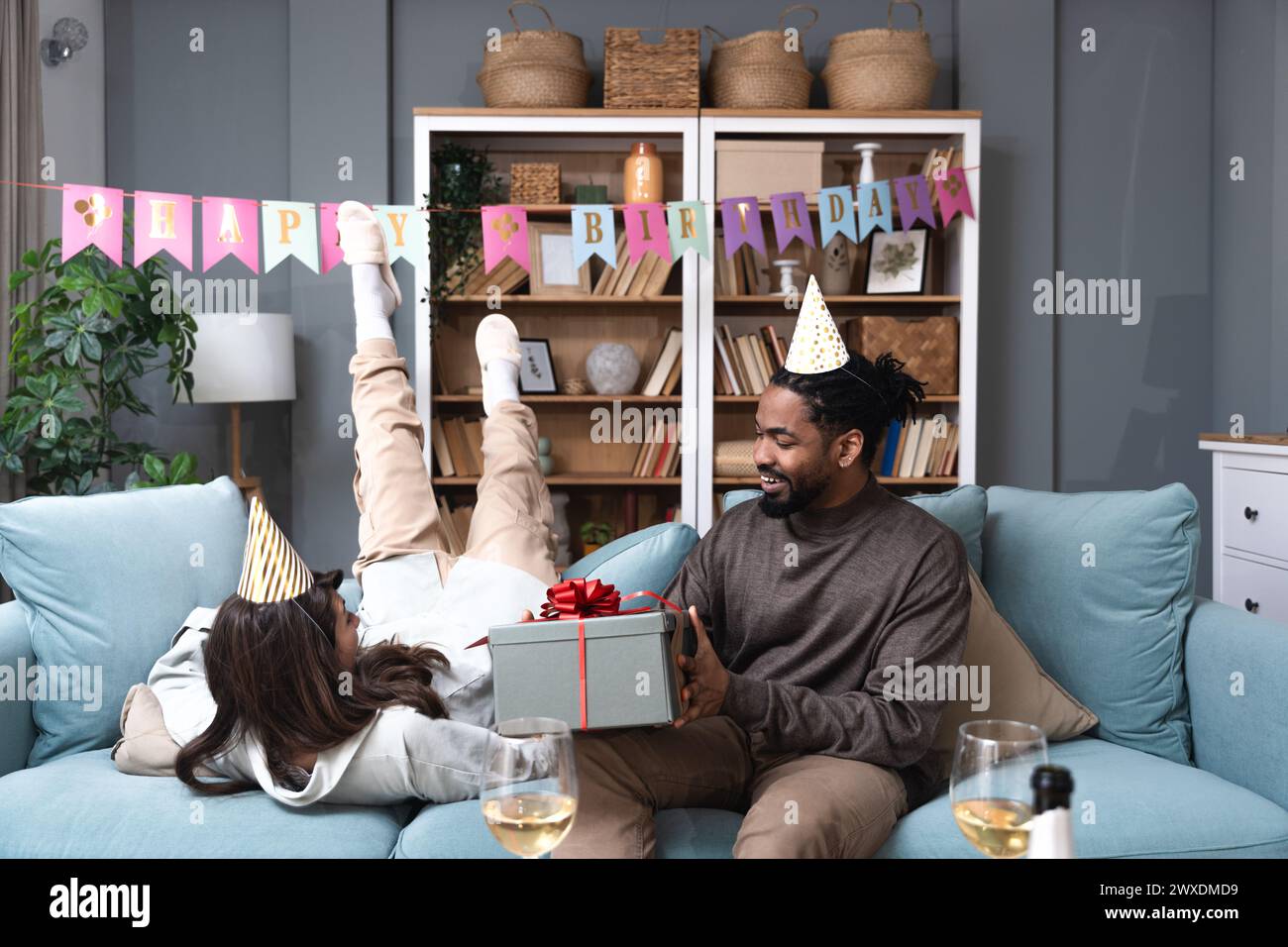 Crazy birthday party. Young couple celebrating birthday in their ...