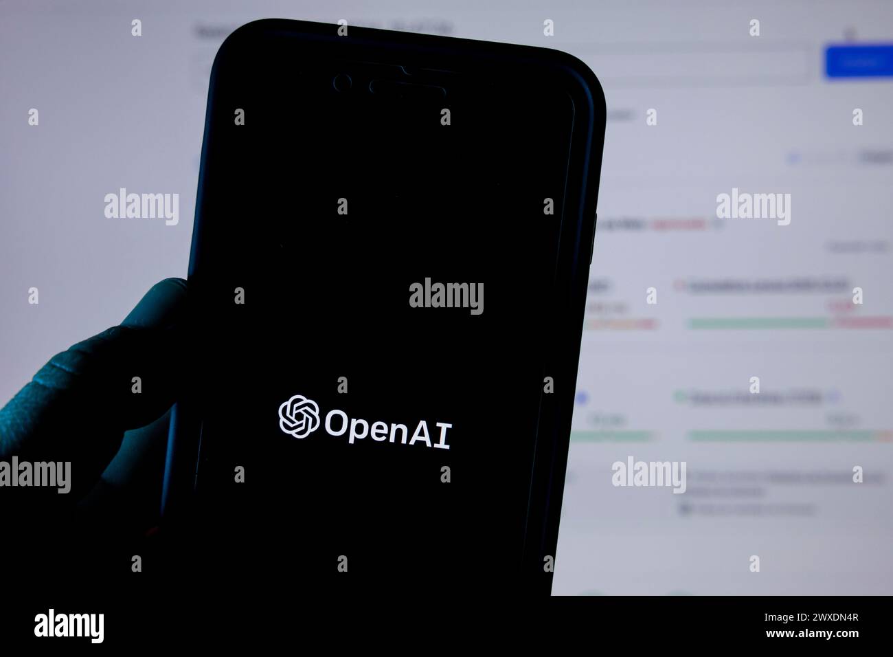 Azores, Portugal - 29.03.2024: User holds Smartphone screen with OpenAI ...