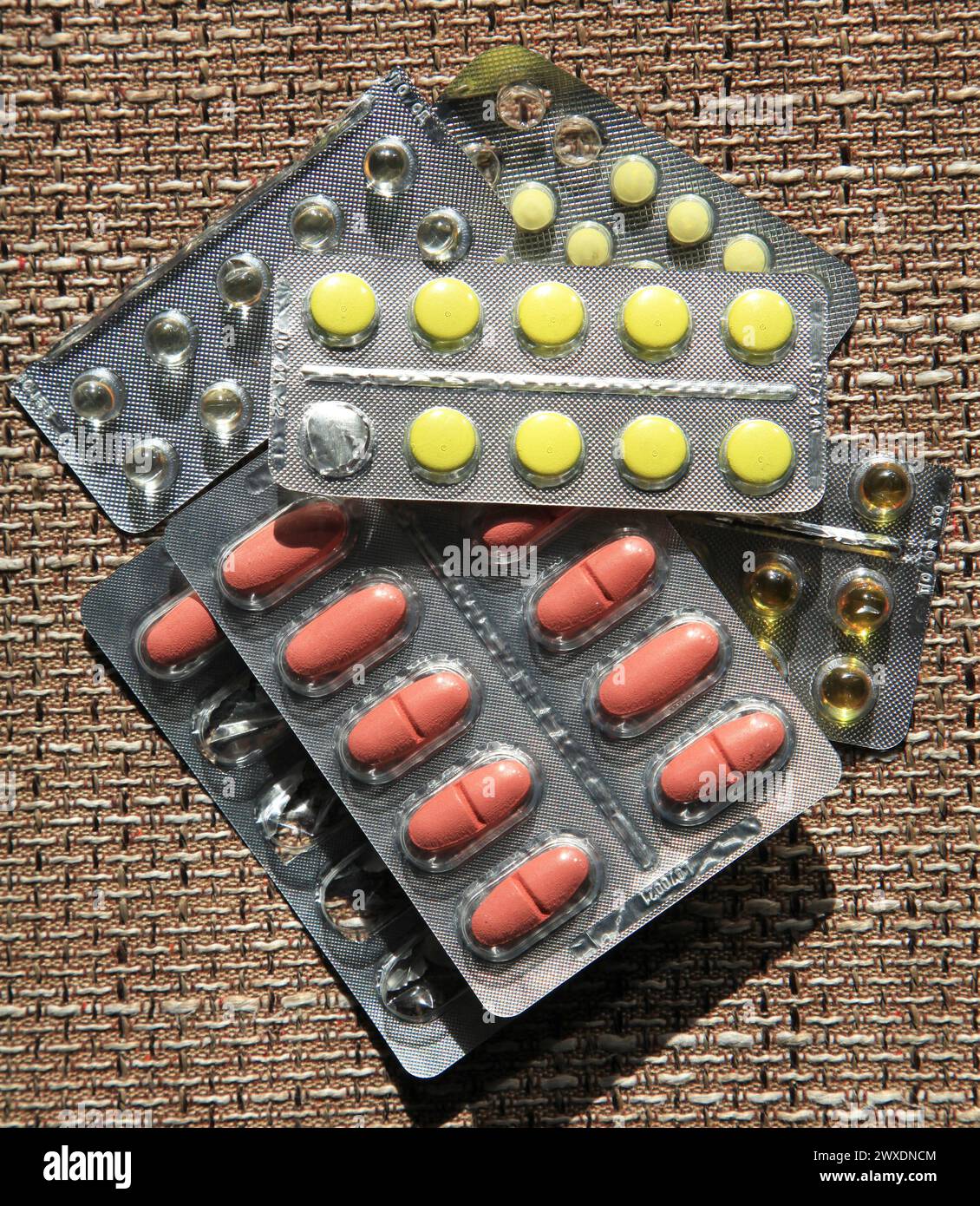 Colorful tablets in plastic blisters. Medicines in pharmaceutical ...