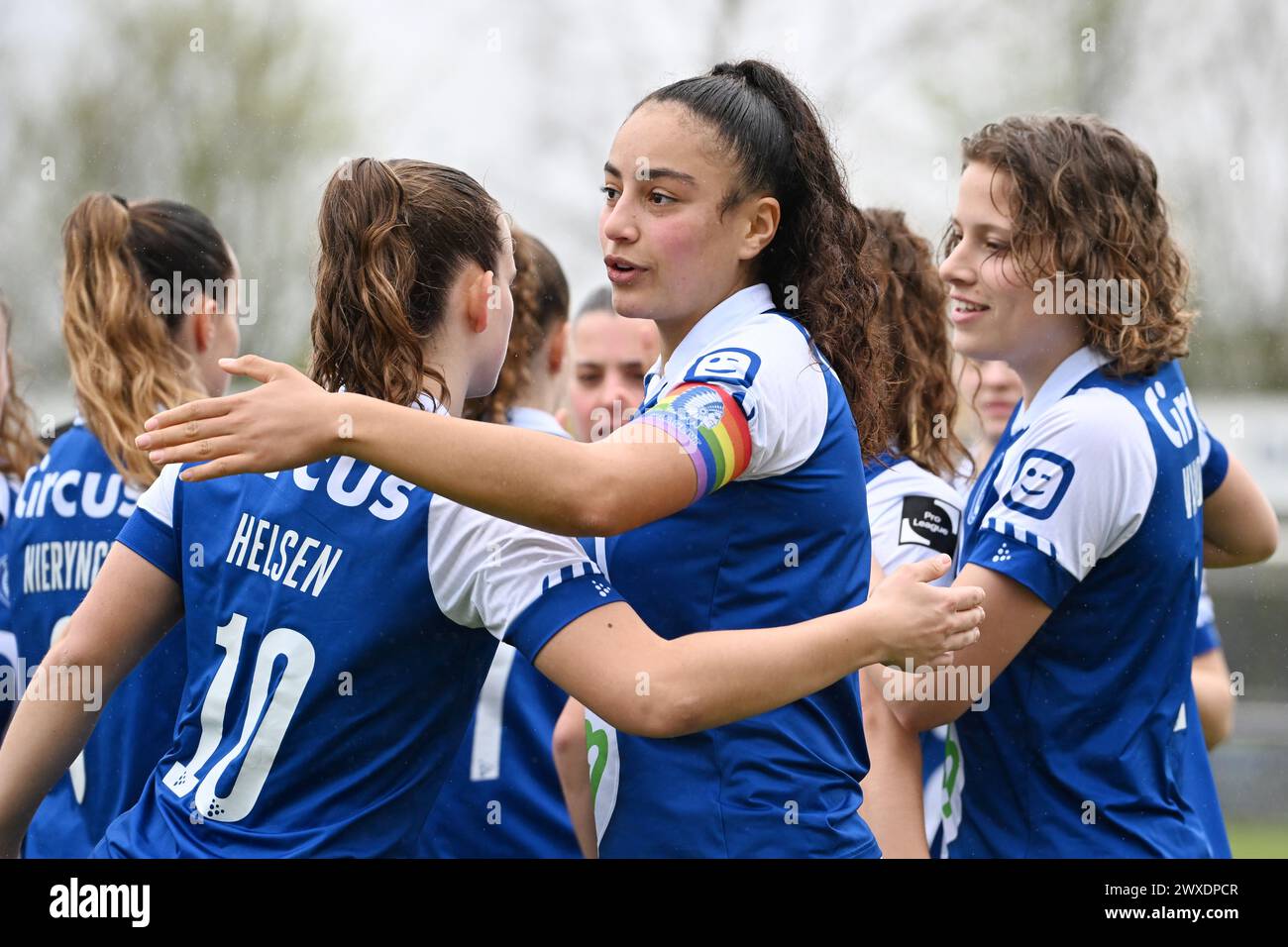Oostakker, Belgium. 30th Mar, 2024. Nia Elyn (4) of AA Gent pictured with Karlijn Helsen (10) of ...