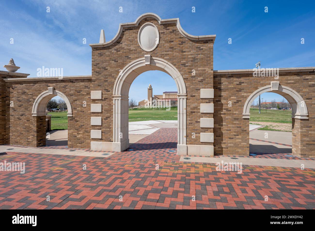 Wall and arches with the arena and its tower on the campus of Texas ...