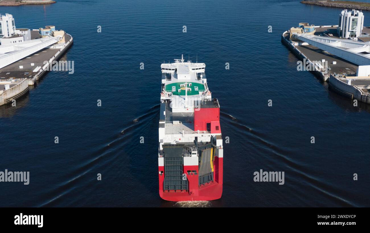 A giant tanker with fuel comes into the seaport, aerial view ...