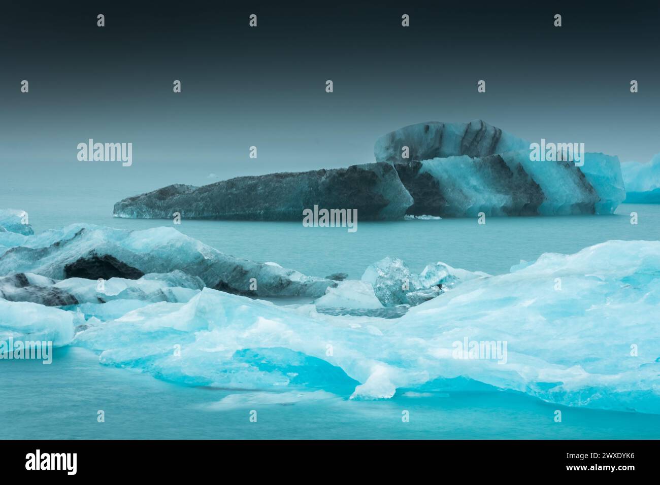 Floating iceberg of the Jokulsarlon Glacier Lagoon under heavy rain ...