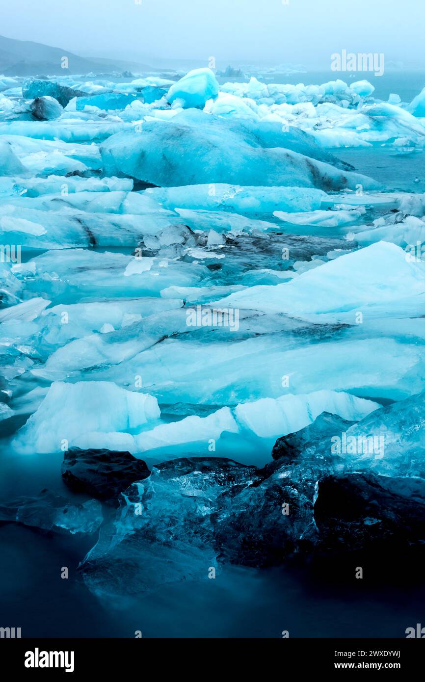 Floating iceberg of the Jokulsarlon Glacier Lagoon under heavy rain ...
