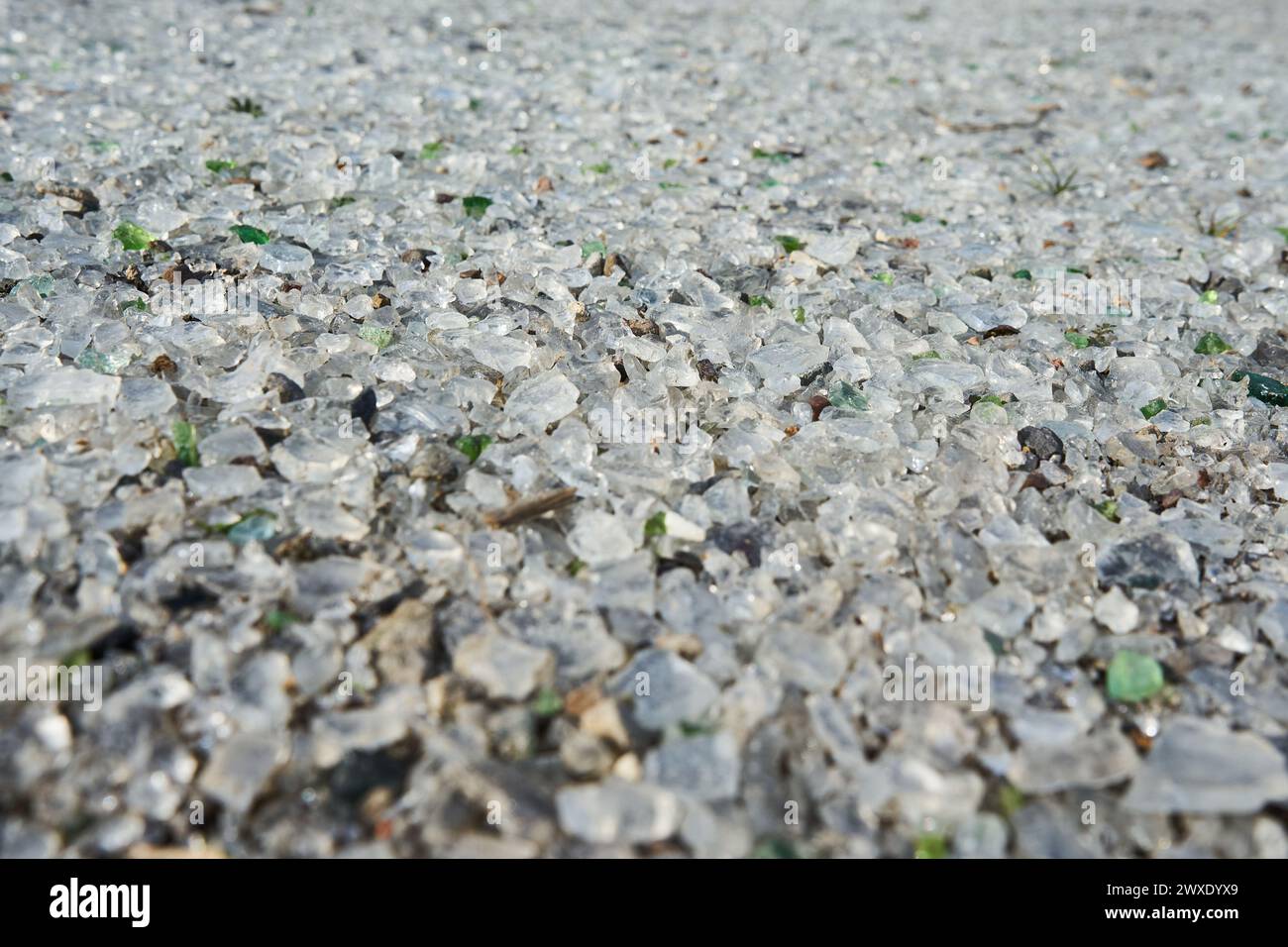 Side view of many small pieces of broken shattered transparent and ...