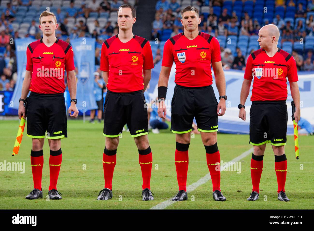 Sydney, Australia. 30th Mar, 2024. Match referees line up on the pitch ...