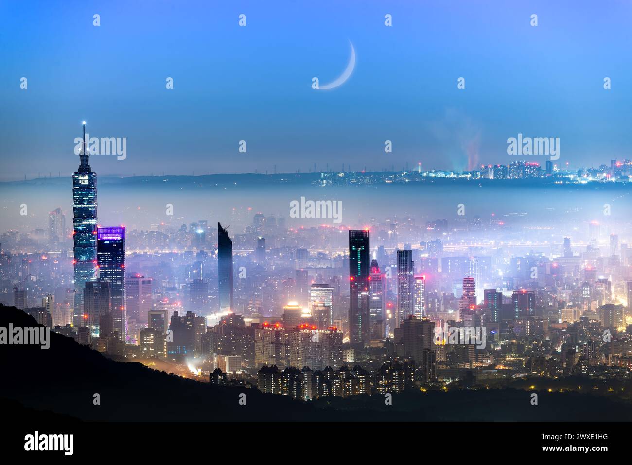 A layer of white clouds and mist over Taipei City, together with the ...
