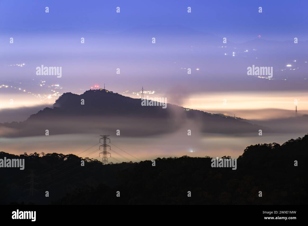 A layer of white clouds and mist over Taipei City, together with the ...
