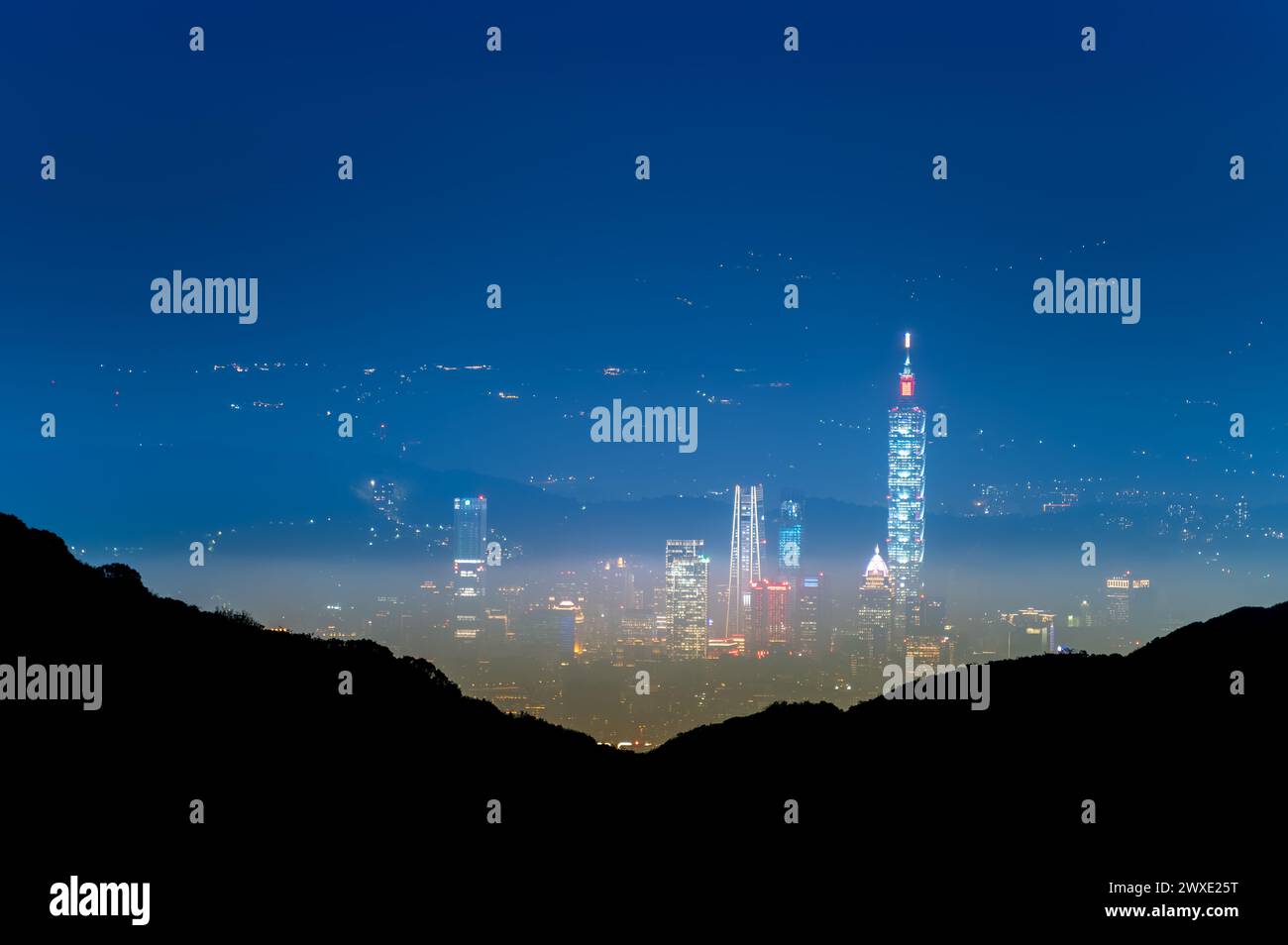 A layer of white clouds and mist over Taipei City, together with the ...