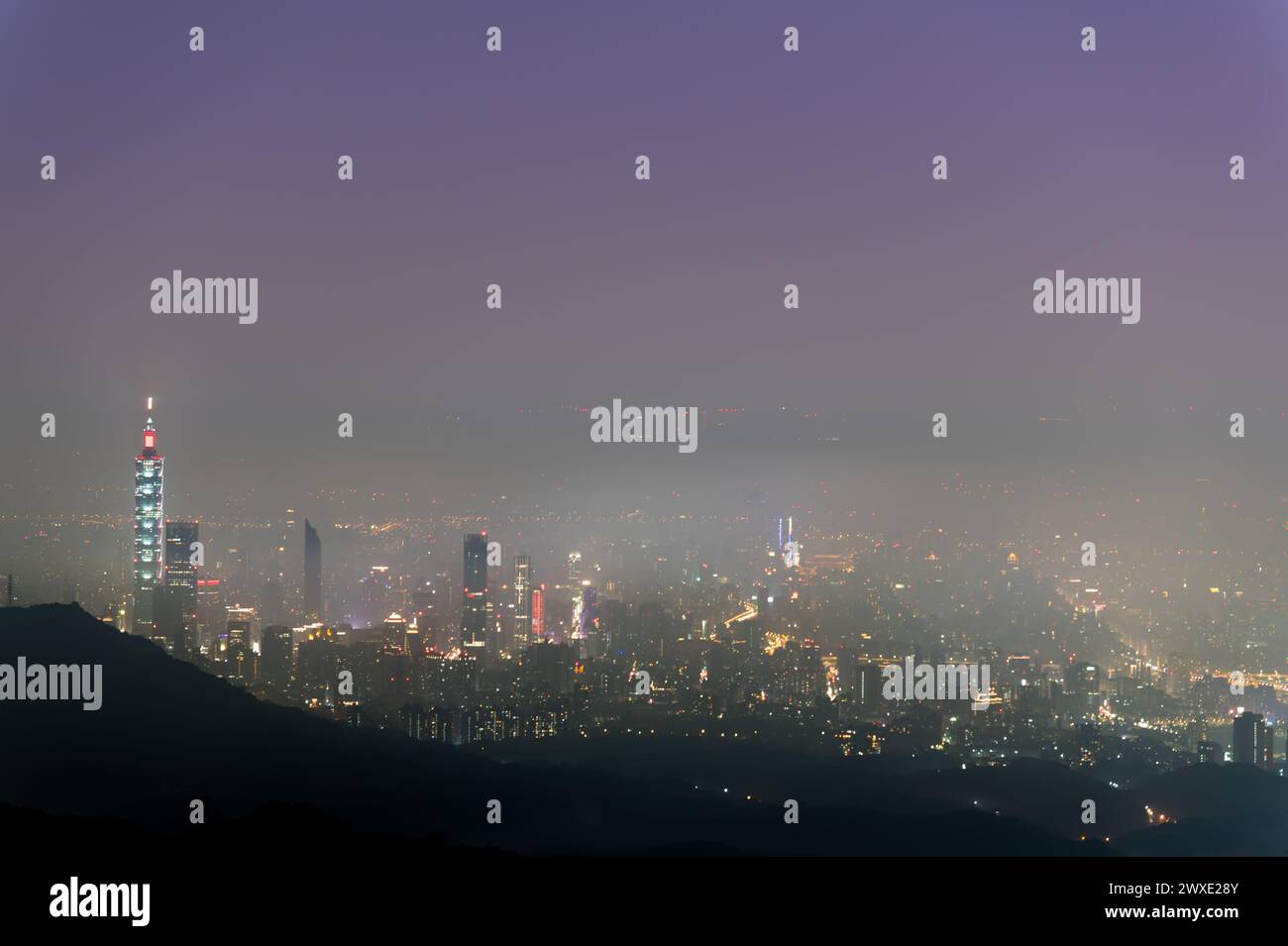 A layer of white clouds and mist over Taipei City, together with the ...