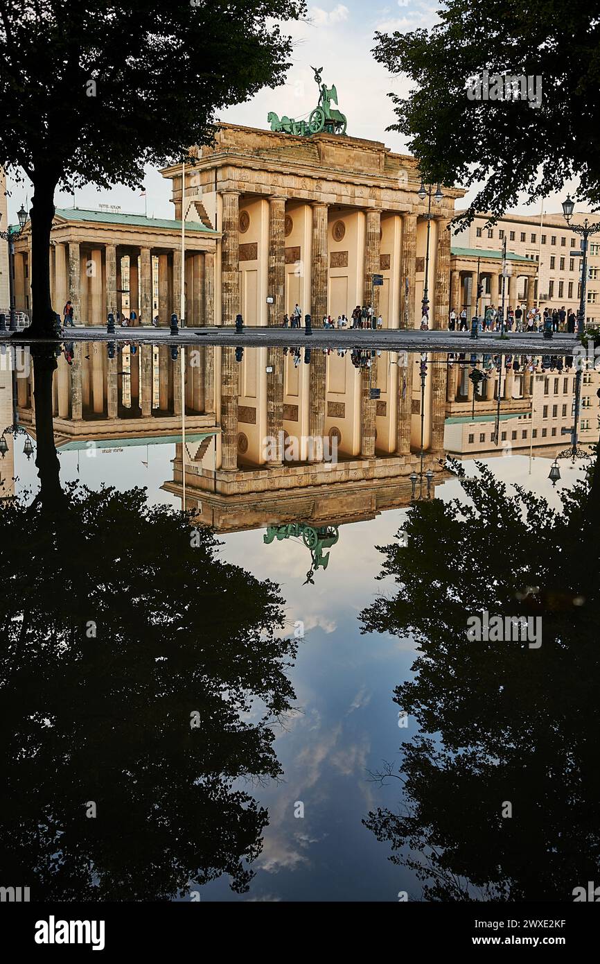 Famous Brandenburger Tor mirroring in a puddle Stock Photo - Alamy