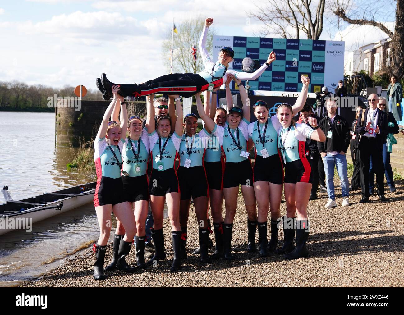 Cambridge Women lift up cox Hannah Murphy after winning the 78th Women ...
