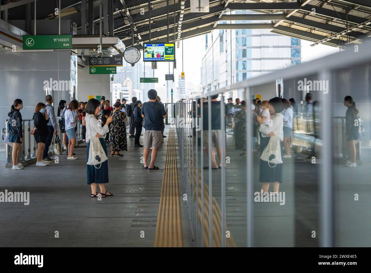 Passengers are seen waiting for the Yellow Line monorail, on the Lat ...