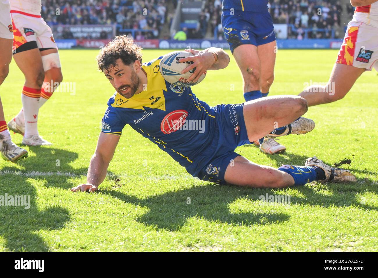 Toby King of Warrington Wolves goes over for a tryduring the Betfred ...