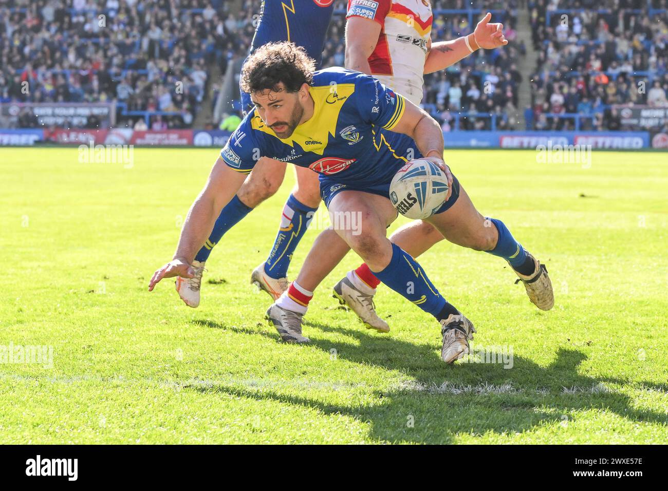 Toby King of Warrington Wolves goes over for a tryduring the Betfred ...