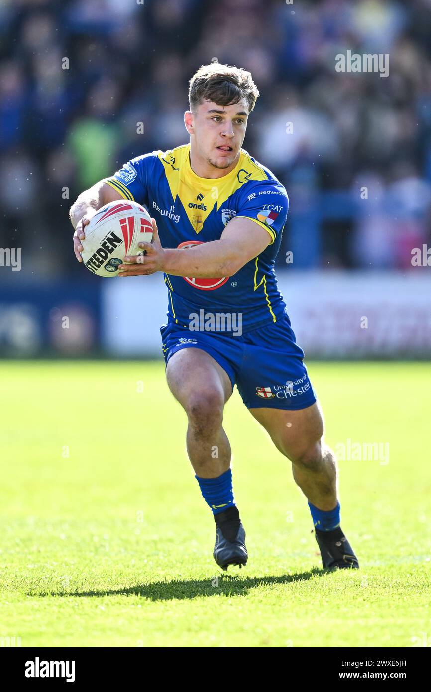 Leon Hayes of Warrington Wolves makes a break during the Betfred Super ...
