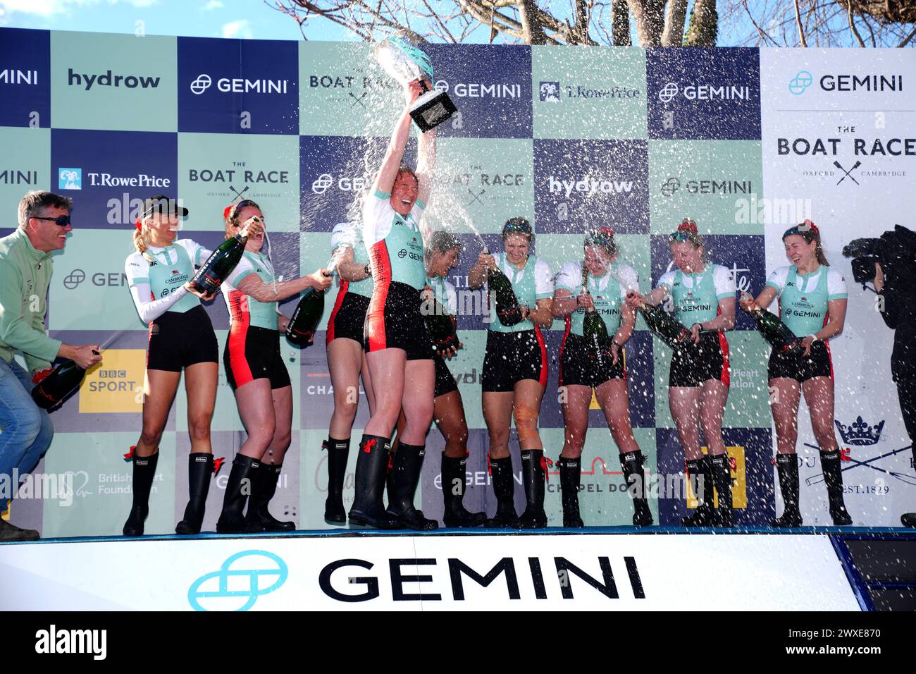 Cambridge Women's President Jenna Armstrong lifts the trophy with the ...