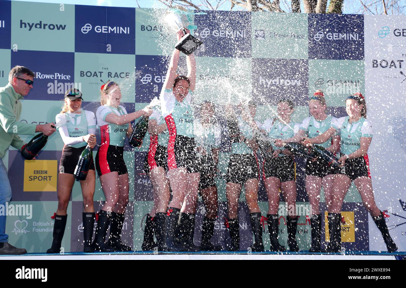 Cambridge Women's President Jenna Armstrong lifts the trophy with the ...