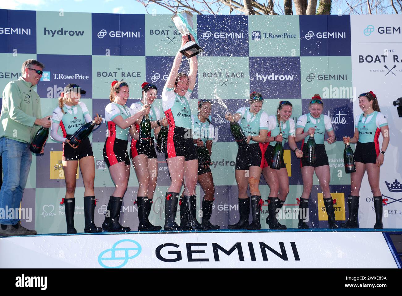 Cambridge Women's President Jenna Armstrong lifts the trophy with the ...