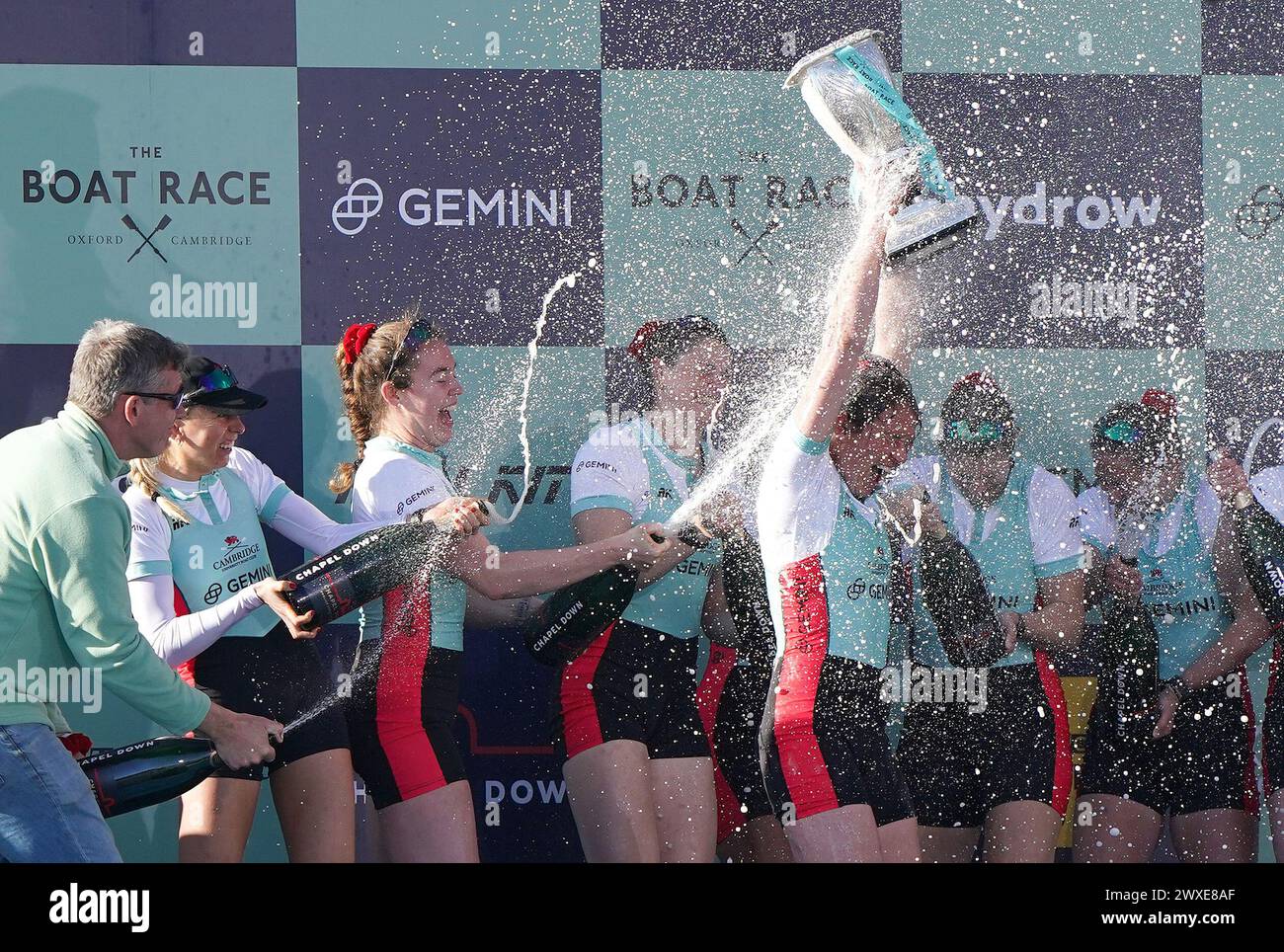 Cambridge Women's President Jenna Armstrong lifts the trophy with the ...