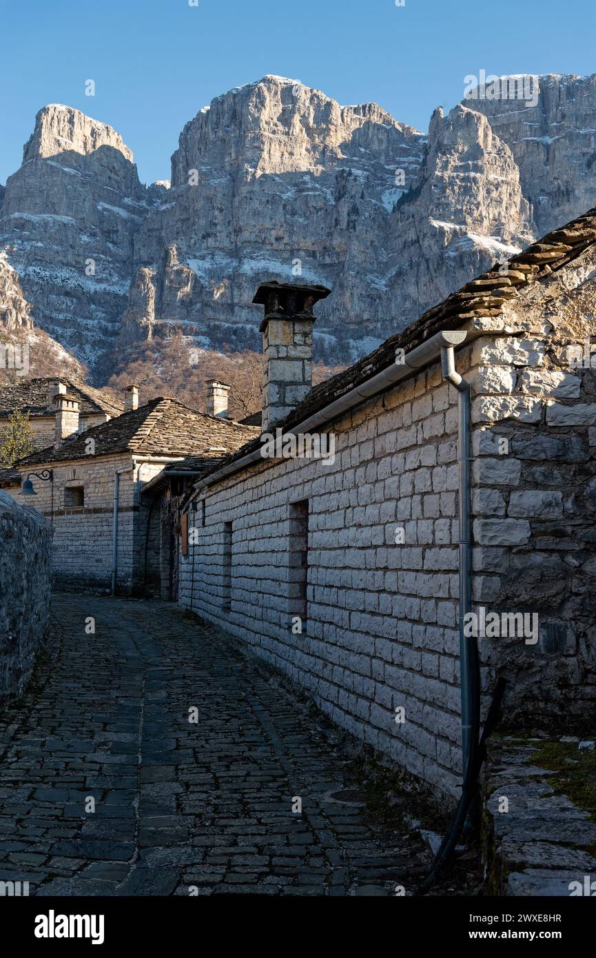 Stone houses of traditional architecture and cobble-stone narrow street ...