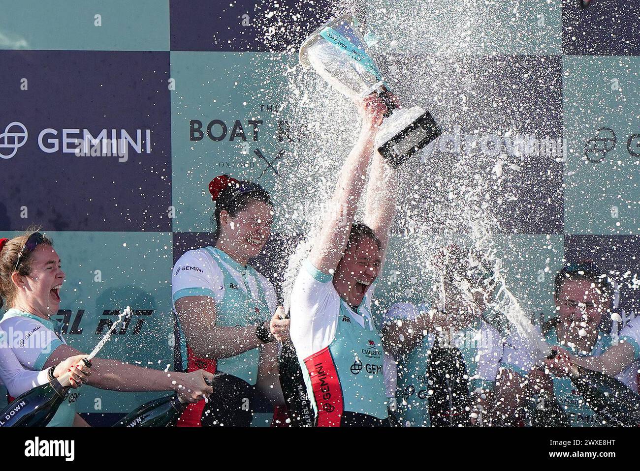 Cambridge Women's President Jenna Armstrong lifts the trophy with the ...