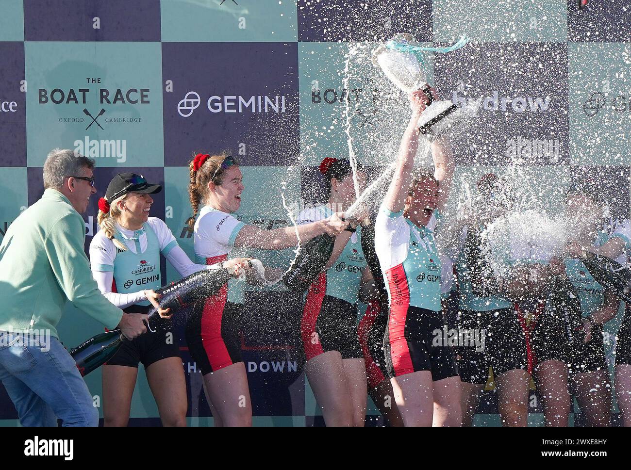 Cambridge Women's President Jenna Armstrong lifts the trophy with the ...