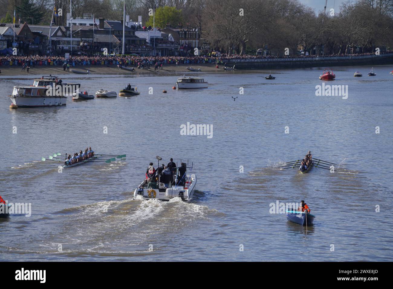Putney, London 30 March 2024 . Large crowds gather on THames embankment ...