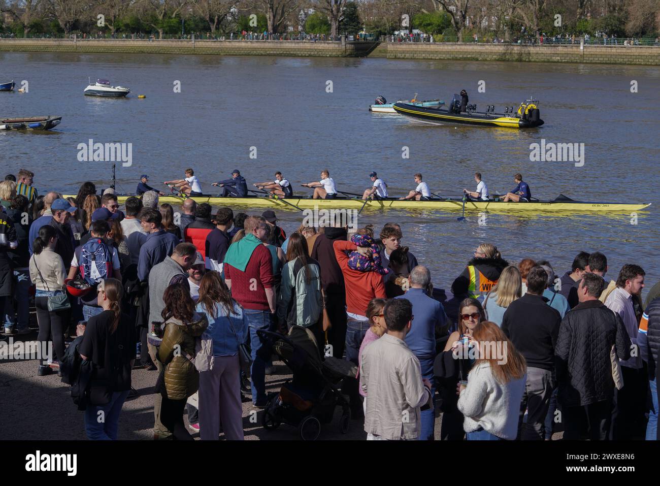 Putney, London 30 March 2024 . Large crowds gather on THames embankment ...