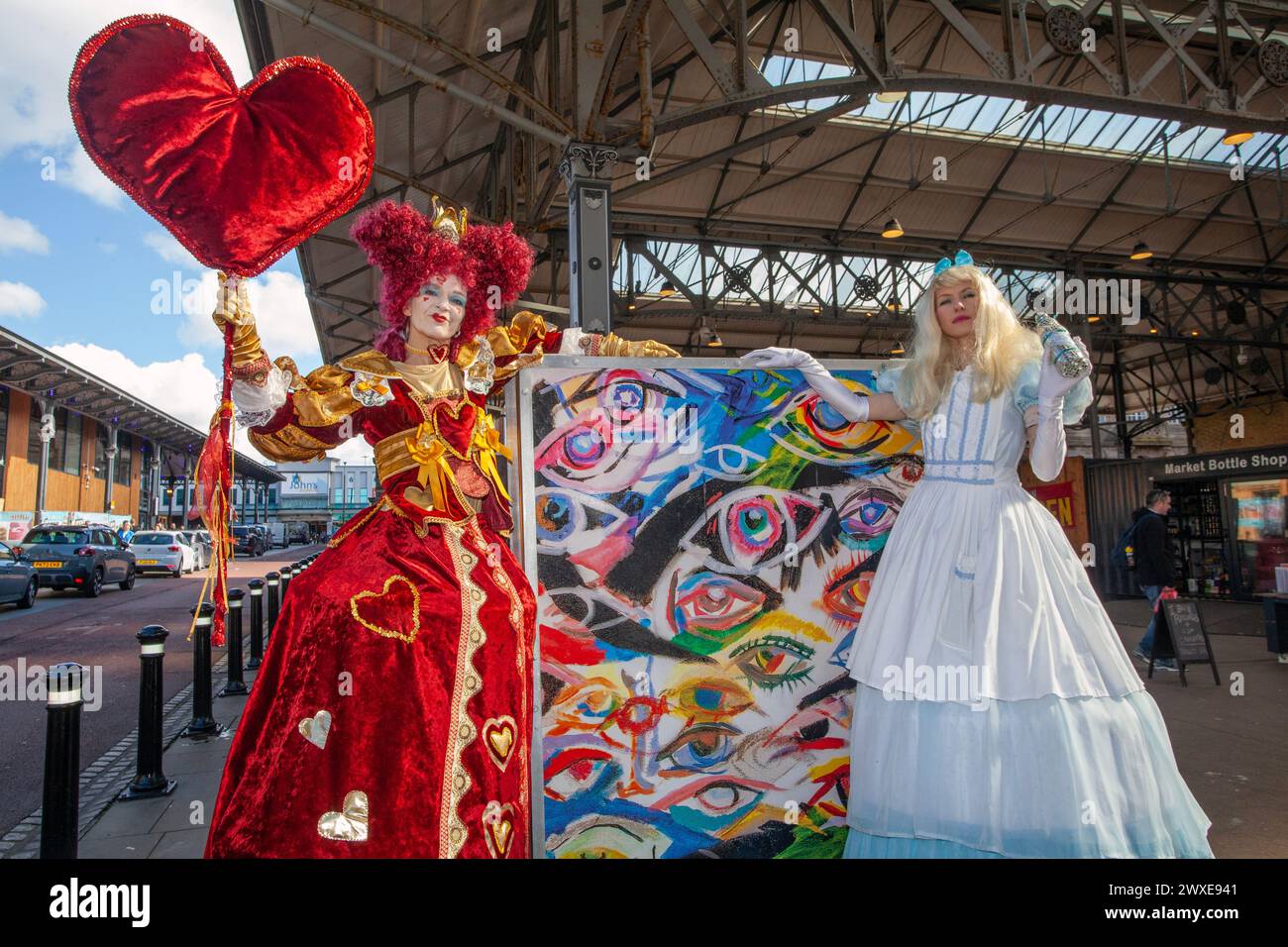 Preston, UK. 30 Mar 2024. The Queen of Hearts and Alice in Wonderland ...