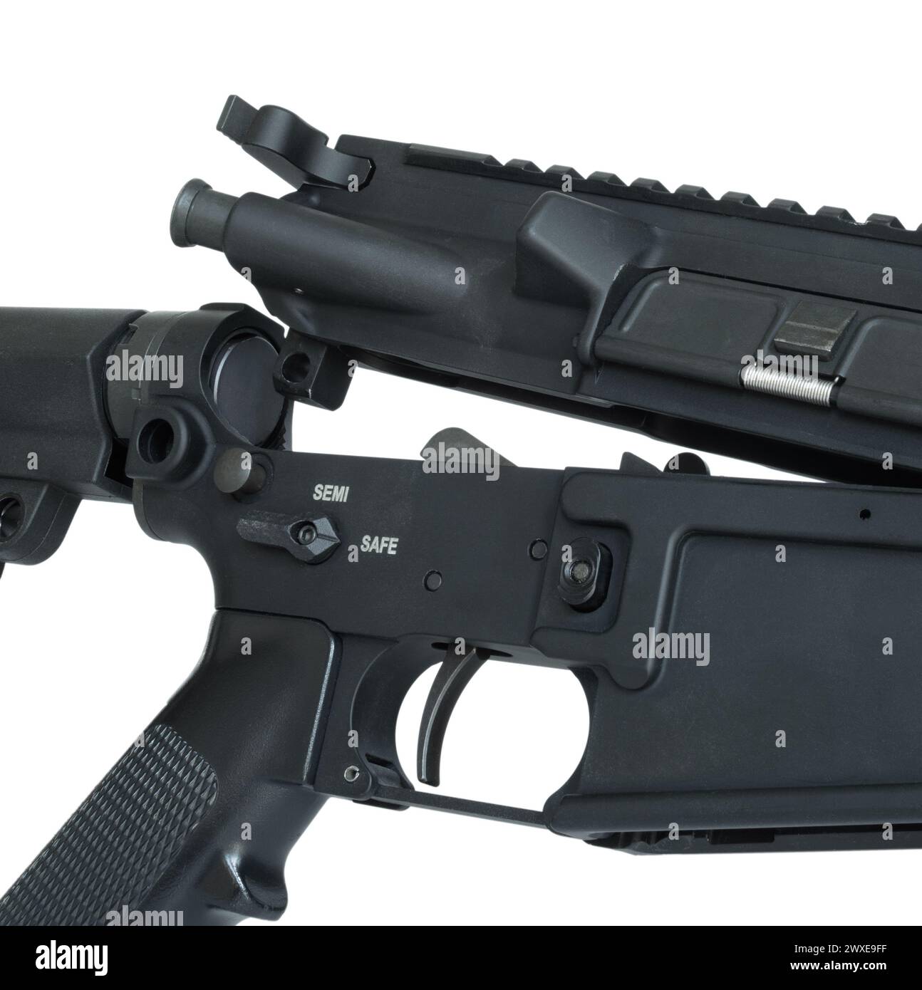 Upper and lower receivers on an AR-15 rotating apart for dissambly so ...