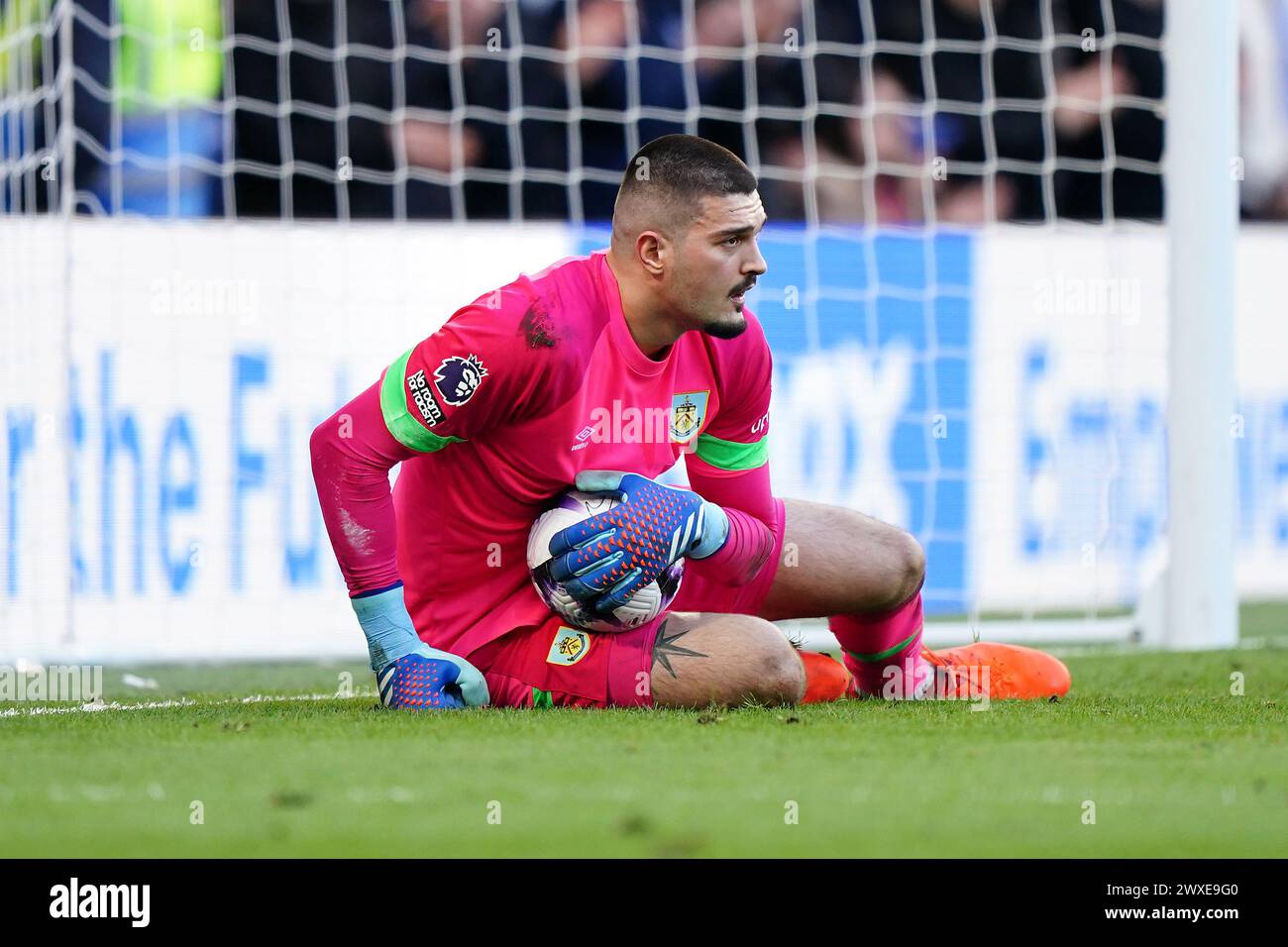 Burnley goalkeeper Arijanet Muric makes a save during the Premier ...