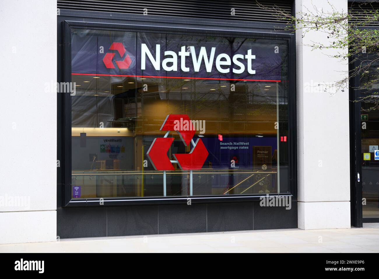 London, UK - March 25, 2024; NatWest bank branch building with name and ...