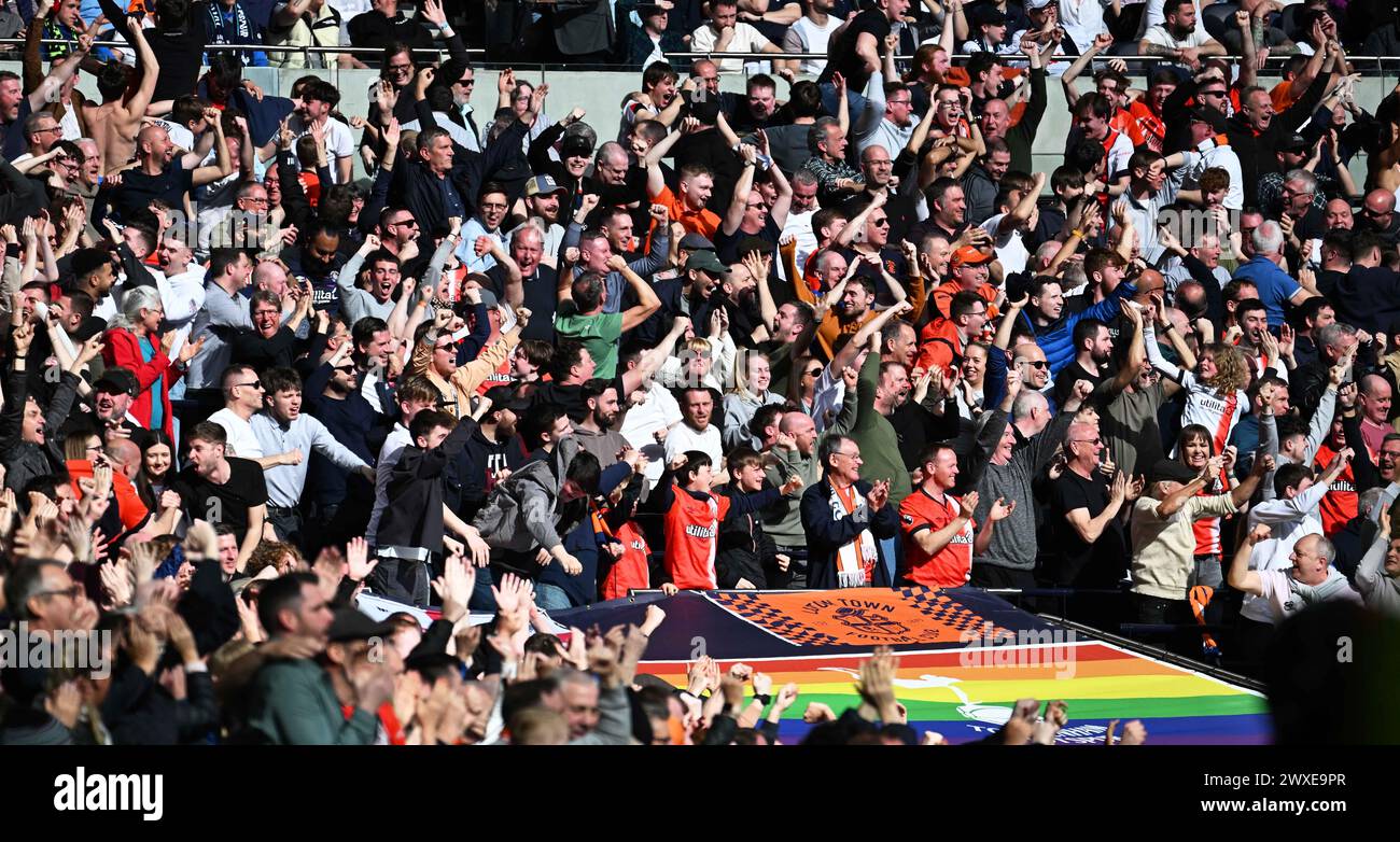 London, UK. 30th Mar, 2024. Luton Town fans celebrate their early goal ...
