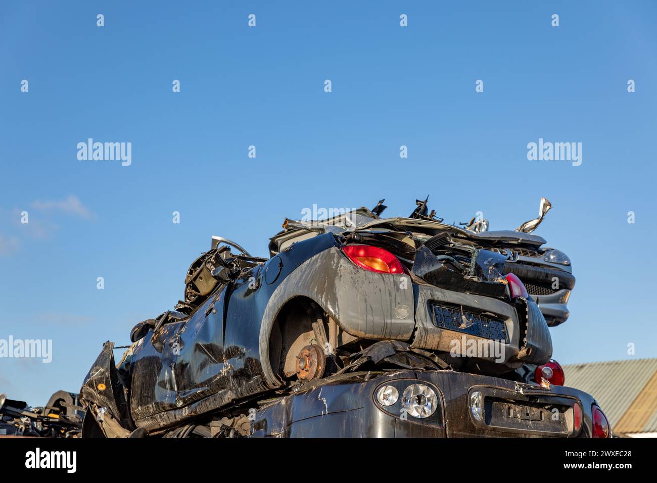 Stacked cars at a junkyard in the South-Holland village of Lisse in the ...