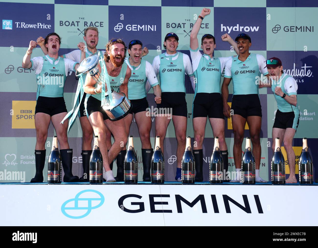 Cambridge Men's President Sebastian Benzecry lifts the trophy with the ...