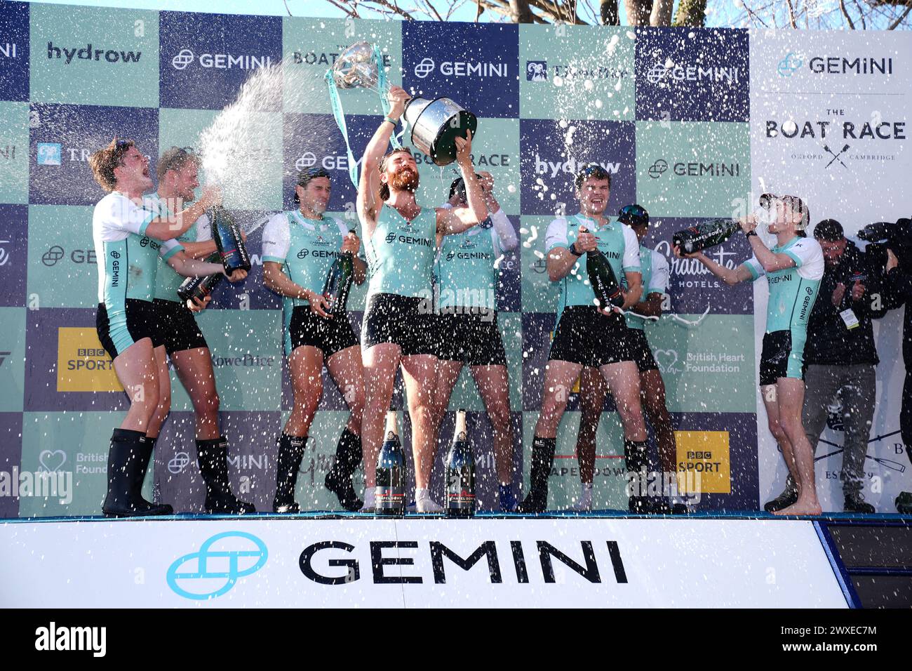 Cambridge Men's President Sebastian Benzecry lifts the trophy with the ...