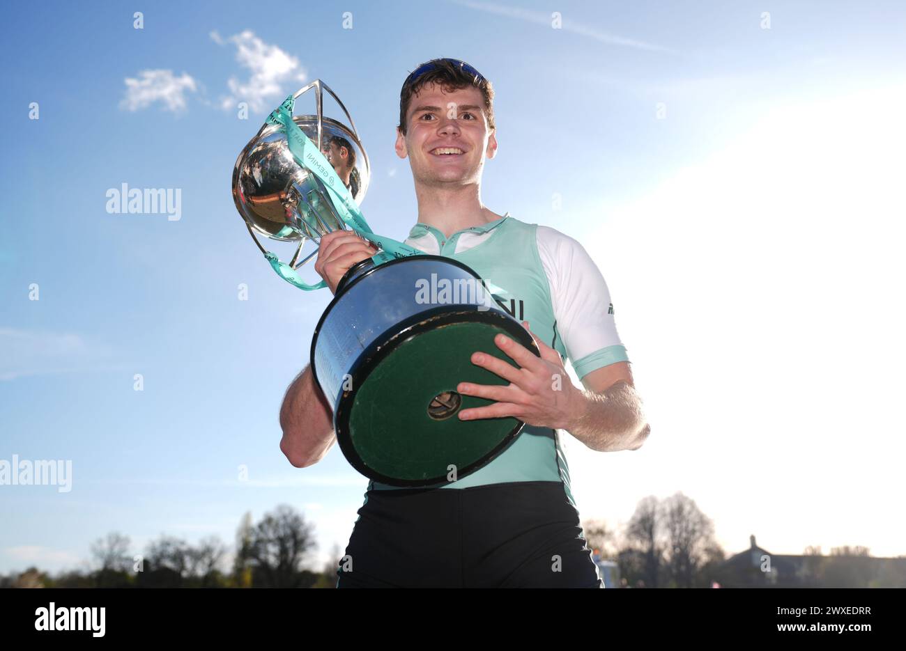 Cambridge Men's Thomas Marsh celebrates with the trophy after the ...