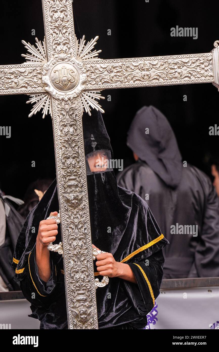 Antigua, Guatemala. 29th Mar, 2024. Wearing the capirote pointed hat, a ...