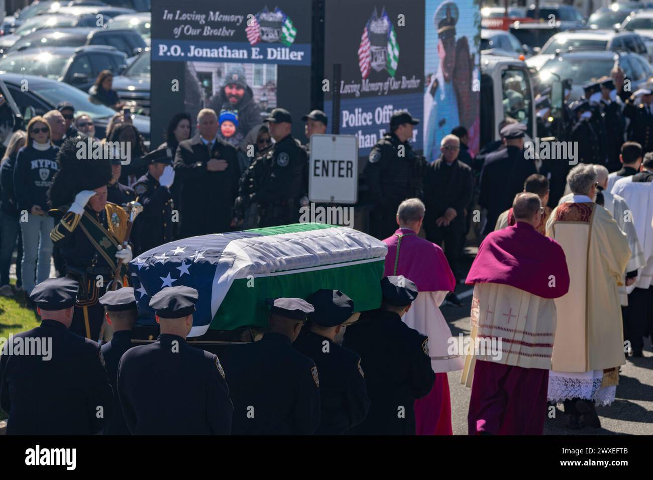 Police officers carry the casket during a funeral service for New York ...