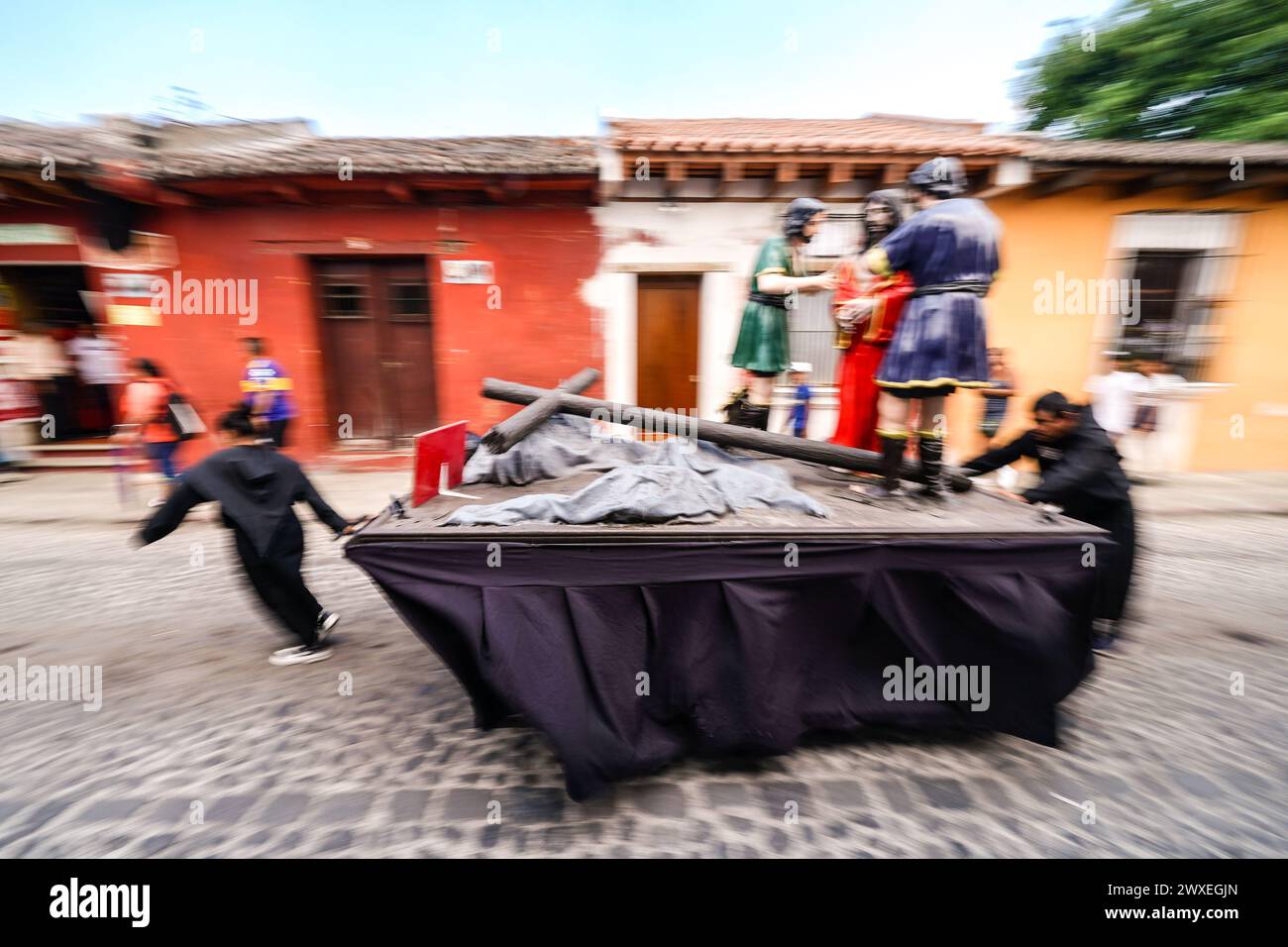 Antigua, Guatemala. 29th Mar, 2024. Catholic penitents roll a ...