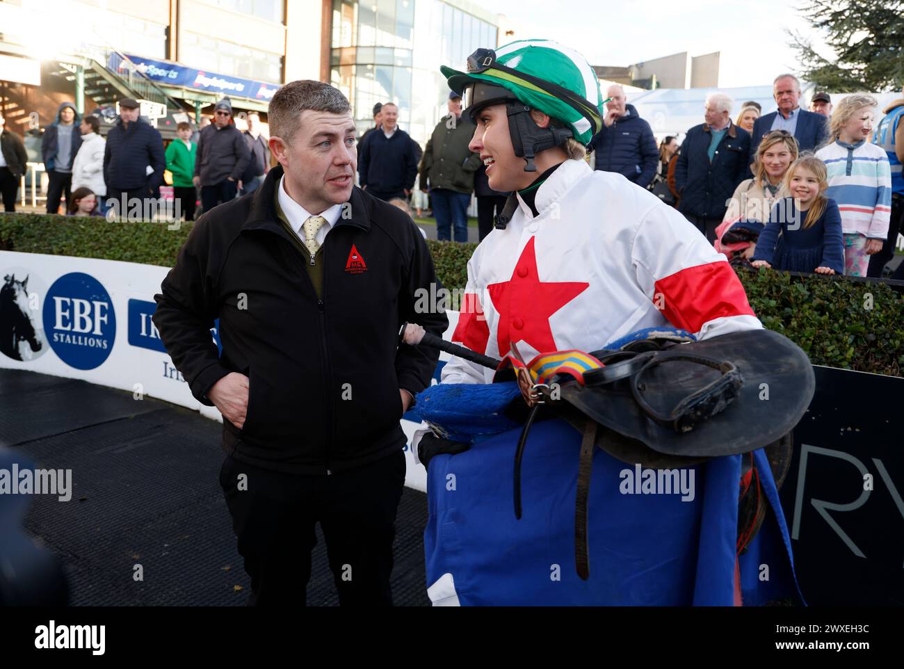 Jockey Miss A B O'Connor (right) speaks with trainer Anthony McCann ...