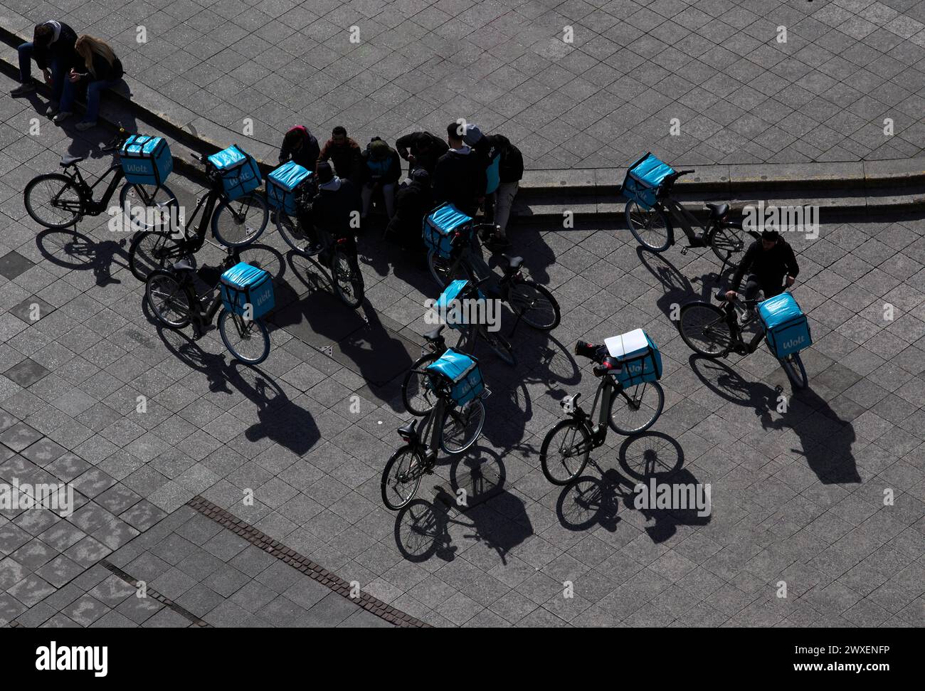 Bicycles and drivers of the food delivery service WOLT at their meeting ...