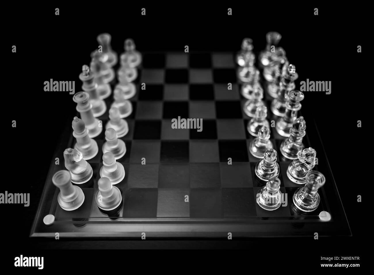 Glass chess board with pieces Stock Photo - Alamy