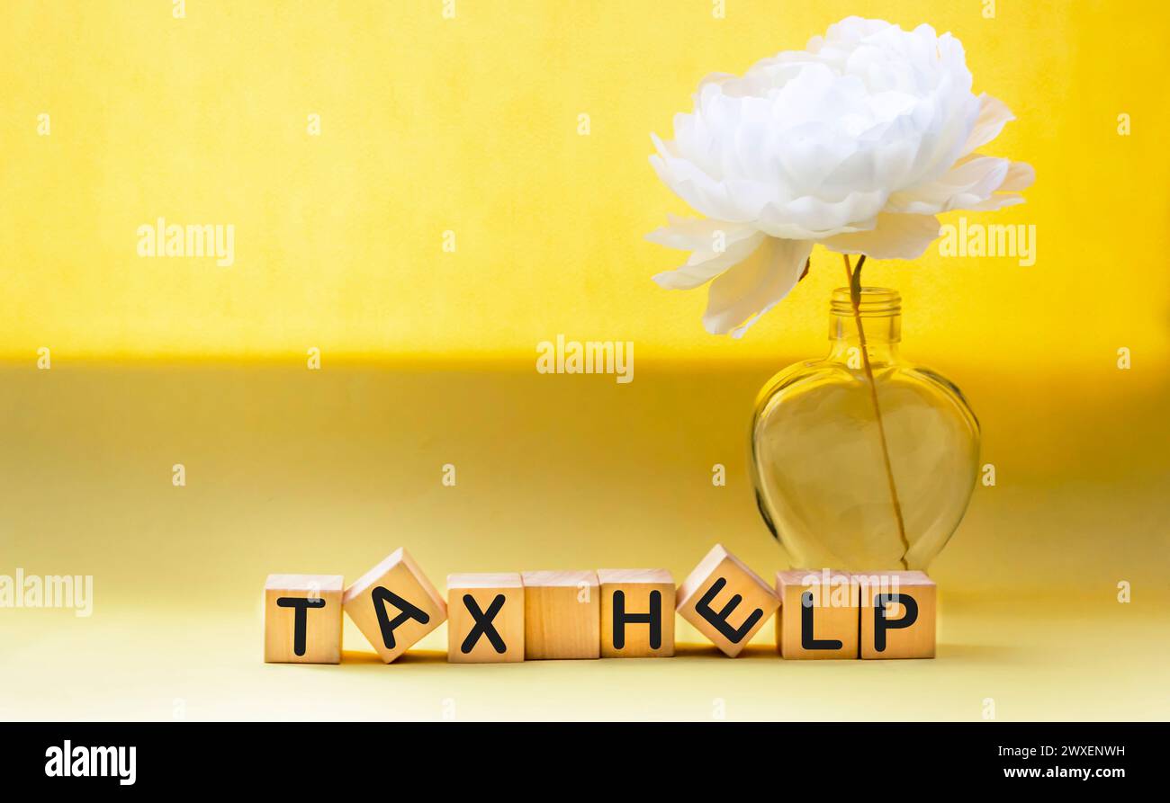 Tax help symbol. Concept word Tax Help on wooden blocks. Beautiful ...
