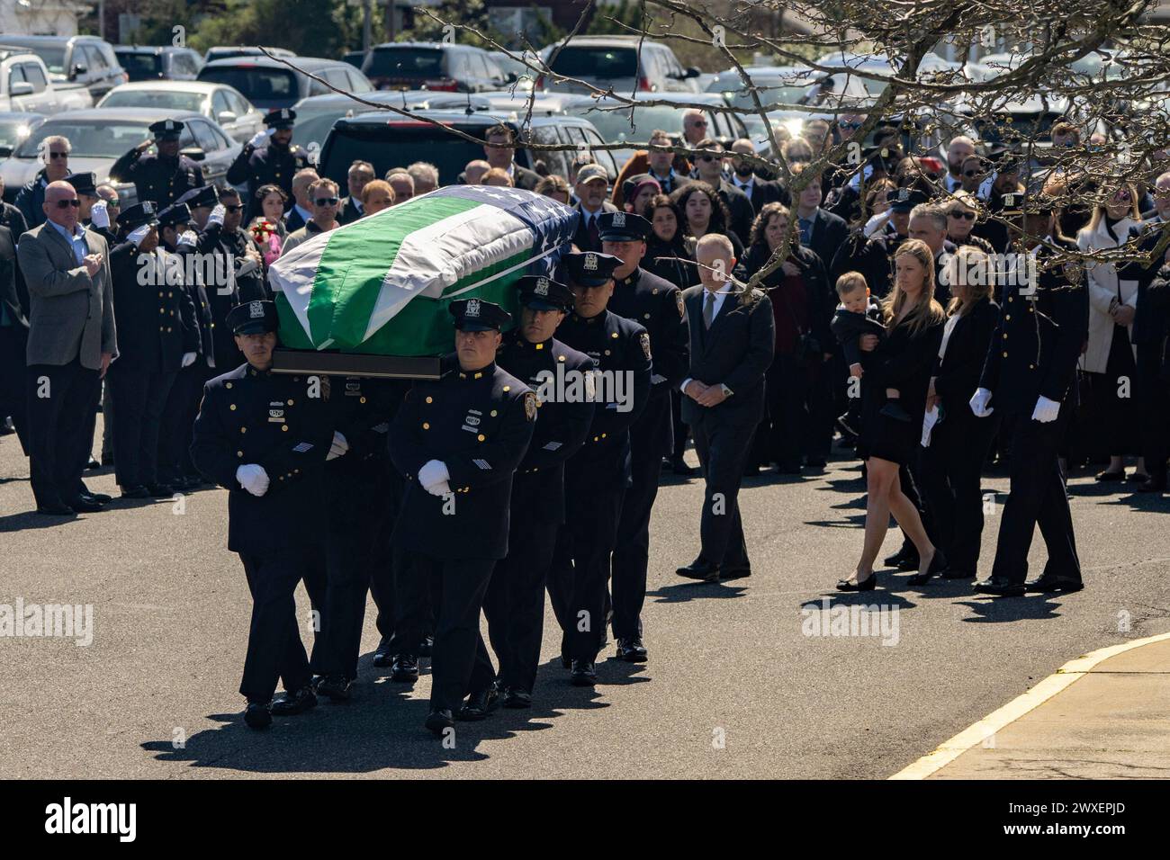 Police officers carry the casket during a funeral service for New York ...
