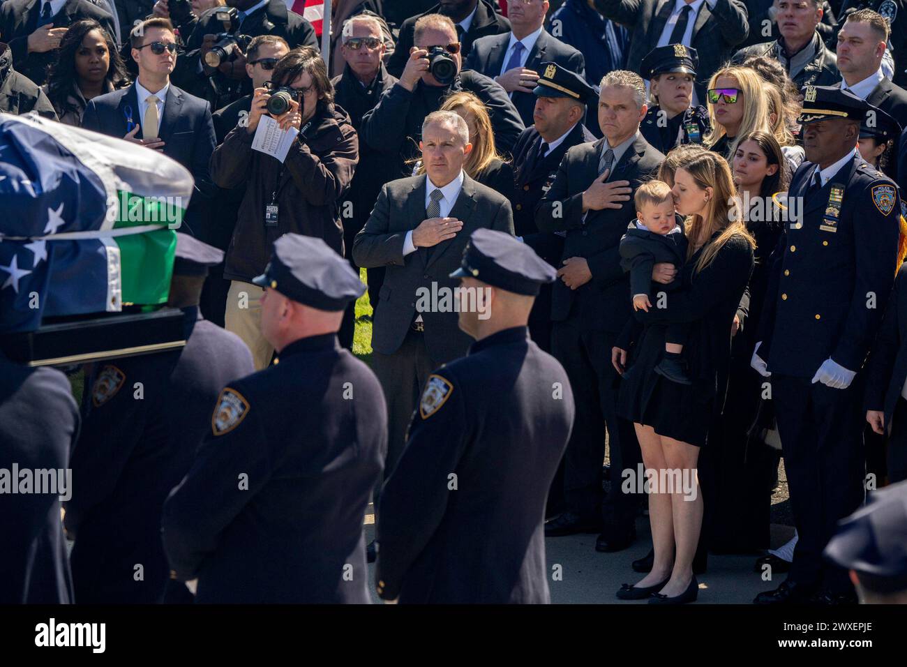 Jonathan Diller's wife Stephanie Diller kisses to her son during a ...