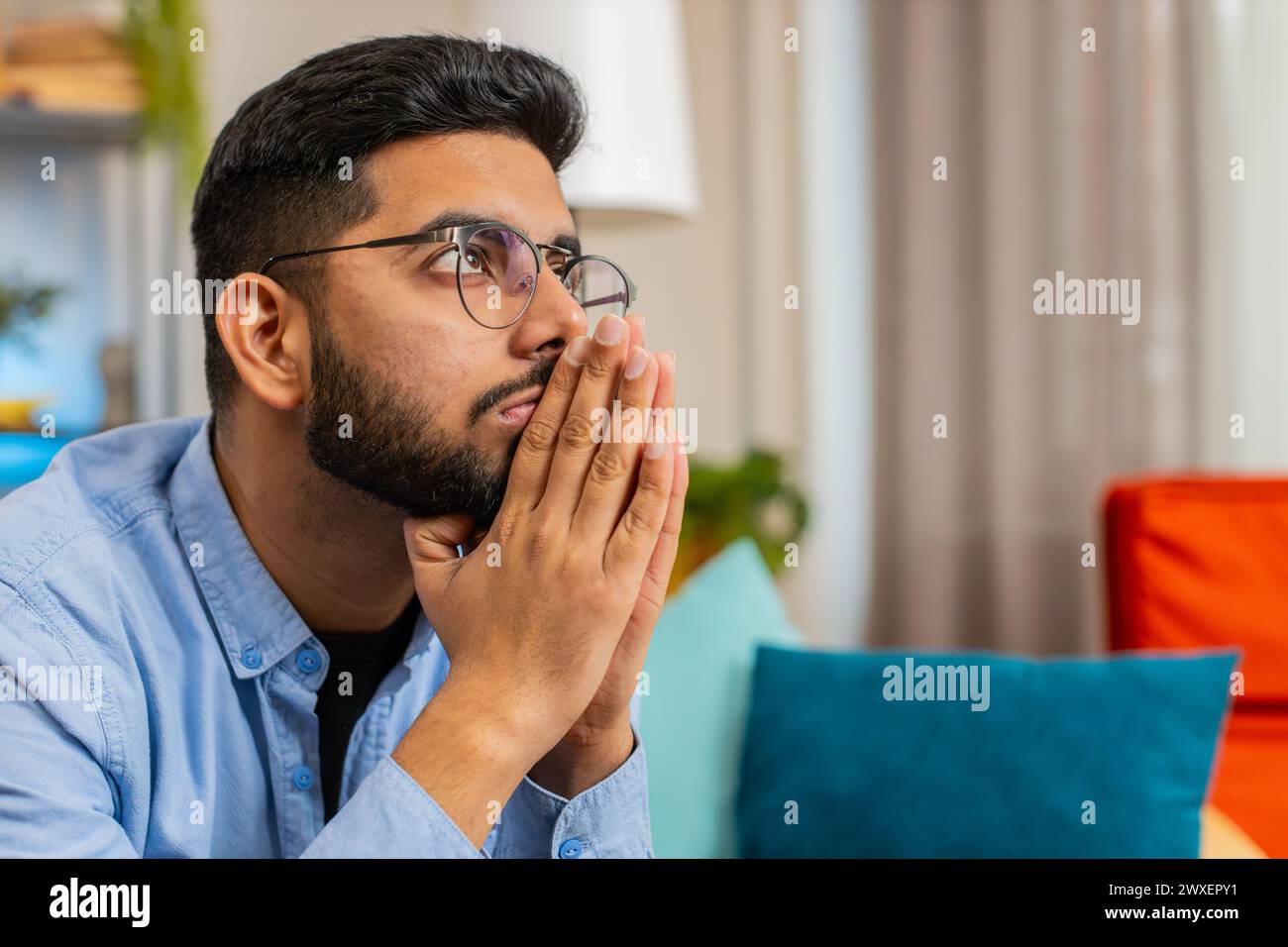 Man praying anxious worried hi-res stock photography and images - Alamy